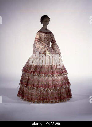 This ensemble consists of a coordinated set of garments, reflecting the ...