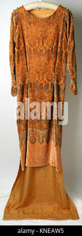 This historical evening dress demonstrates formal fashion, intricate ...
