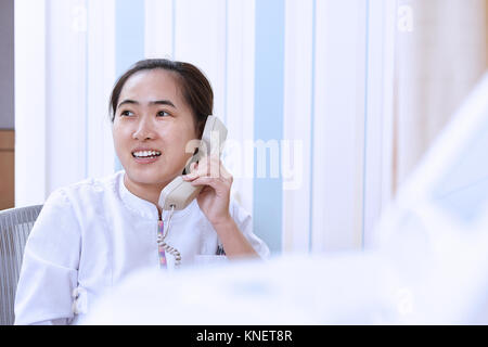 Nurse making telephone call Stock Photo - Alamy