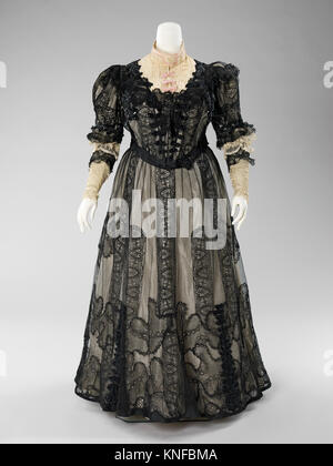 An ensemble, reflecting coordinated fashion or costume design. The ...