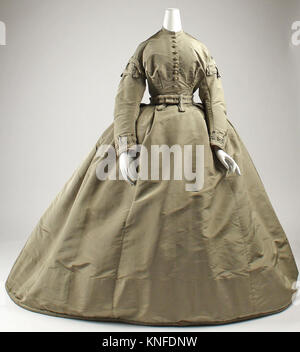 This ensemble is a complete outfit featuring garments and accessories ...