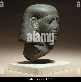 This ancient statue head demonstrates detailed facial features ...