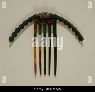 This historical comb demonstrates grooming practices, cultural ...