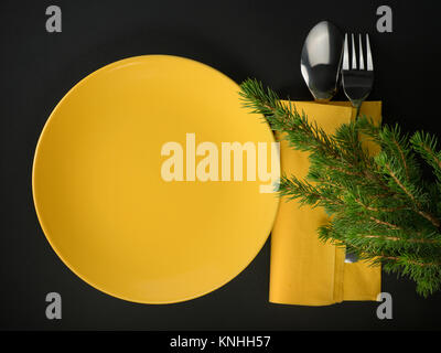 Composition with empty plate, fir branches, Christmas decorations and ...