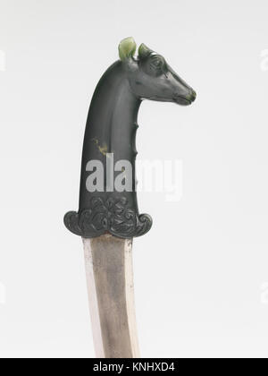 This dagger features a hilt shaped as a blue bull, combining functional ...