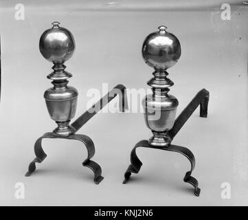 18th-century metal andiron used to support fireplace logs, combining ...