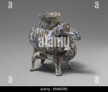 This late 7th-8th century Syrian animal flask is made from blown glass ...
