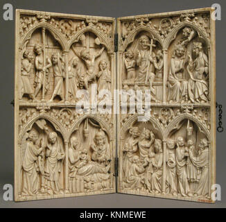 A 14th-century French diptych made of ivory with metal mounts ...