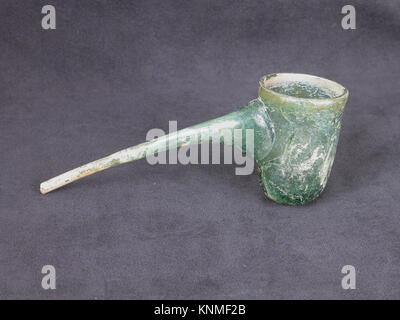 A 9th-11th century green glass alembic from Nishapur, Iran, used for ...