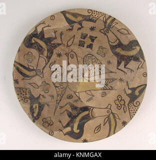 The base of a footed buff ware vessel is an artifact from ancient ...