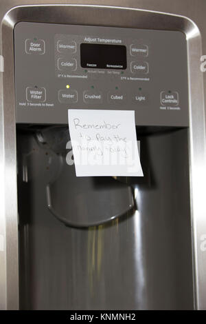 Sticky notes stuck on refrigerator Stock Photo - Alamy