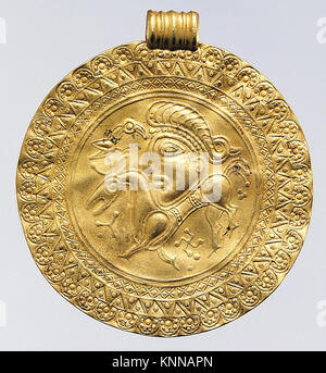 Gold bracteate with engraved designs, reflecting symbolic imagery ...