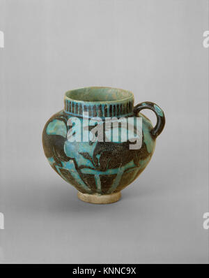 A cup decorated with ibex motifs, made from ceramic. The vessel ...