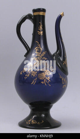 This ewer is a historical pitcher designed for pouring liquids ...