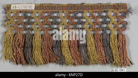 A historical fringe sample showing textile edge finishing, decorative ...