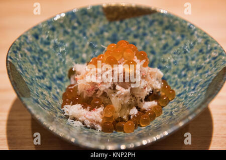 Ikura salmon roe and crab sashimi at an omakase sushi restaurant Stock ...