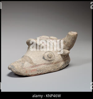 This bull's head mask with human characteristics is a unique example of ...