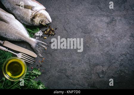 Fish head and tail fishing net wet top view Stock Photo - Alamy