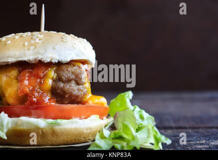 Mini beef burger with bbq sauce and cheddar cheese,selective focus and ...