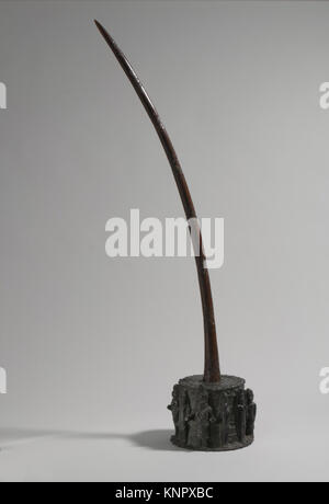 A carved tusk used as an altar object, featuring detailed decoration ...