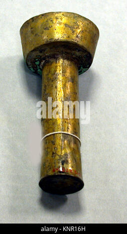 This hammered silver rattle beaker features a textured metal surface ...