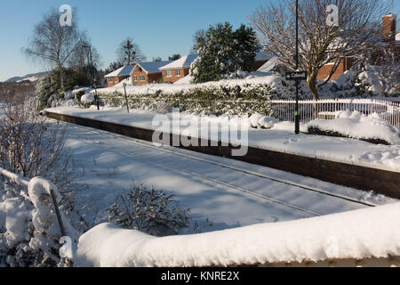 Snow covered railway station at Colwall, Herefordshire, with The ...