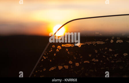 View of the sundown through a slightly open car window Stock Photo - Alamy