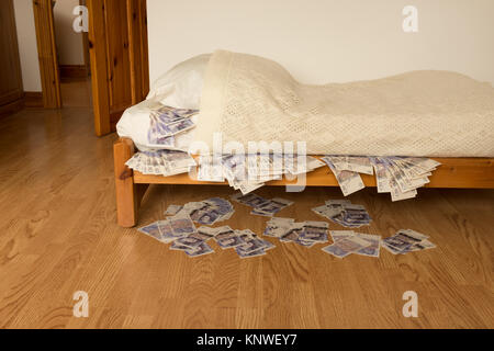 A ready supply of stashed cash money banknotes under the bed mattress ...