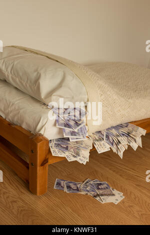 A ready supply of stashed cash money banknotes under the bed mattress ...