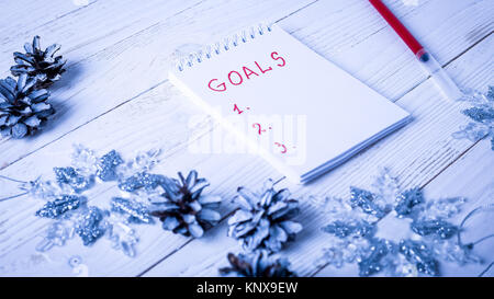 Workplace with a diary, decorations and gifts. New Year's list o Stock ...