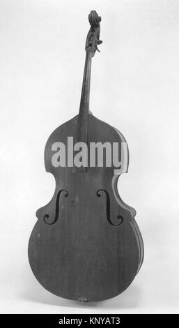 A bass viol, a large stringed instrument of the 17th century, featuring ...