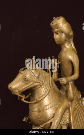 A medieval aquamanile shaped as a falconer on horseback, used as a ...