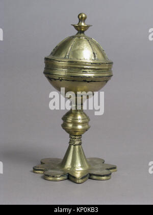 Liturgical metal ciborium with domed cover and pedestal, used to store ...