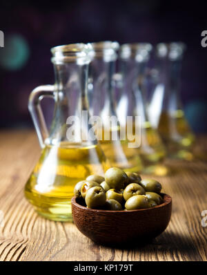 Olive oils in bottles, Mediterranean rural theme Stock Photo - Alamy