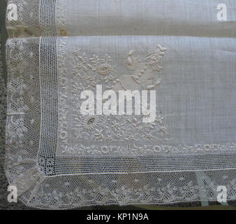 This linen square is a small textile piece woven from flax fibers. The ...