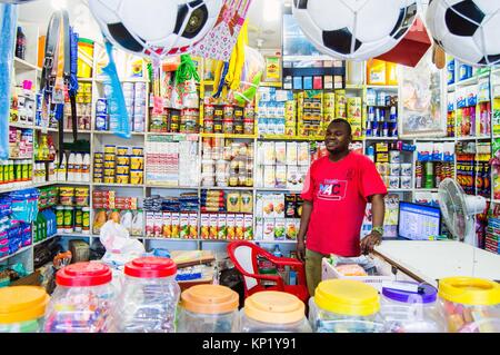 African grocery shop owner inside his shop, Tanji village, Africa ...