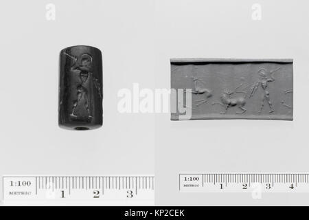 This Greek Ionian black marble cylinder seal from the 5th century B.C ...
