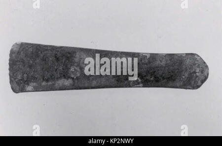 An adze head used for woodworking, showing the metal blade and hafting ...