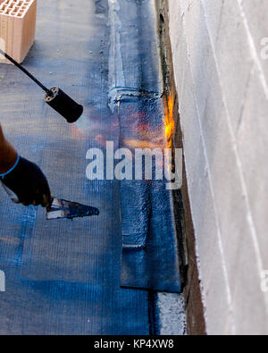 construction worker installing terrace roof on house Stock Photo - Alamy