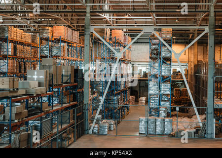 Modern warehouse interior with shelves and boxes and forklift loader ...