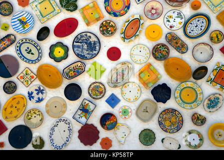 Hand-painted traditional Portuguese pottery at the wall of the pottery ...