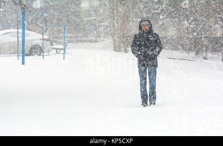 A man walks through snow-covered ground at a work site in Beijing ...