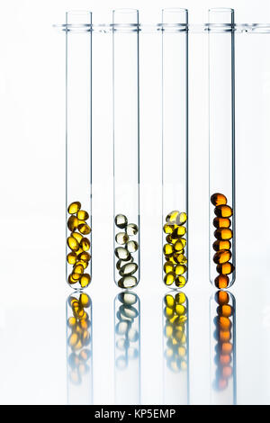 Capsules in test tubes Stock Photo - Alamy