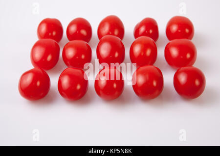 Handful of colorful cherry tomatoes. Isolated over white background ...