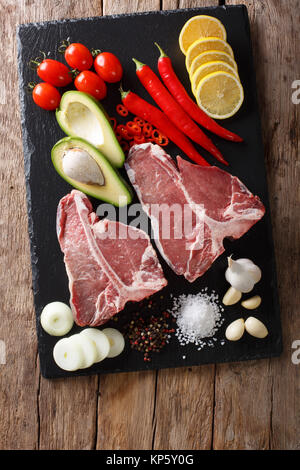 Cutting organic lemon on a wood cutting board Stock Photo - Alamy