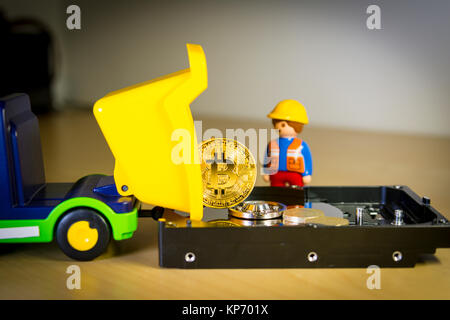 Golden Bitcoin carry or loading on a Truck over a hard disk and a ...