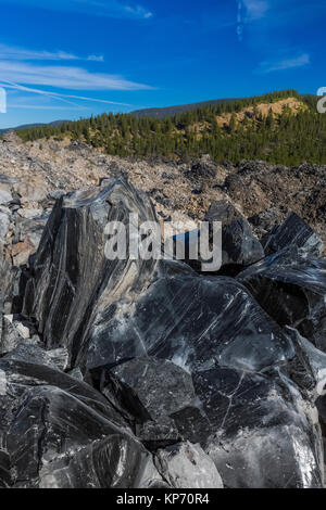 Obsidian rock along the Big Obsidian Flow Trail in Newberry National Volcanic Monument, central ...