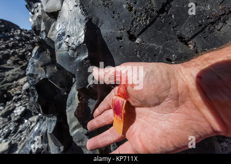 Hand cut by the sharp obsidian along the Big Obsidian Flow Trail in ...