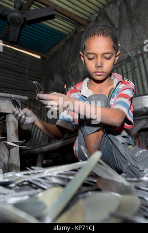 A child labor working Spoon-Making Factory near of Burigonga River at ...