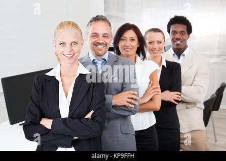 Happy businesspeople smiling cheerfully during a meeting in a coffee ...